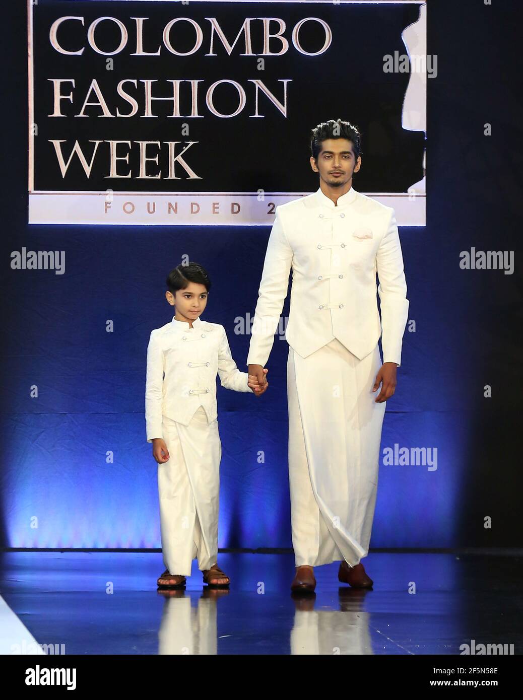 Colombo, Sri Lanka. 26th Mar, 2021. Models present creations during the ...