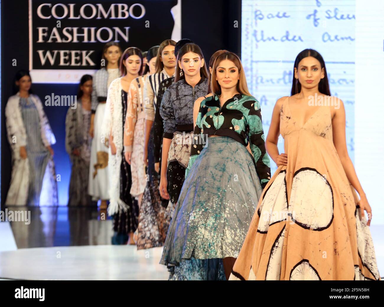 Colombo, Sri Lanka. 26th Mar, 2021. Models present creations during the ...