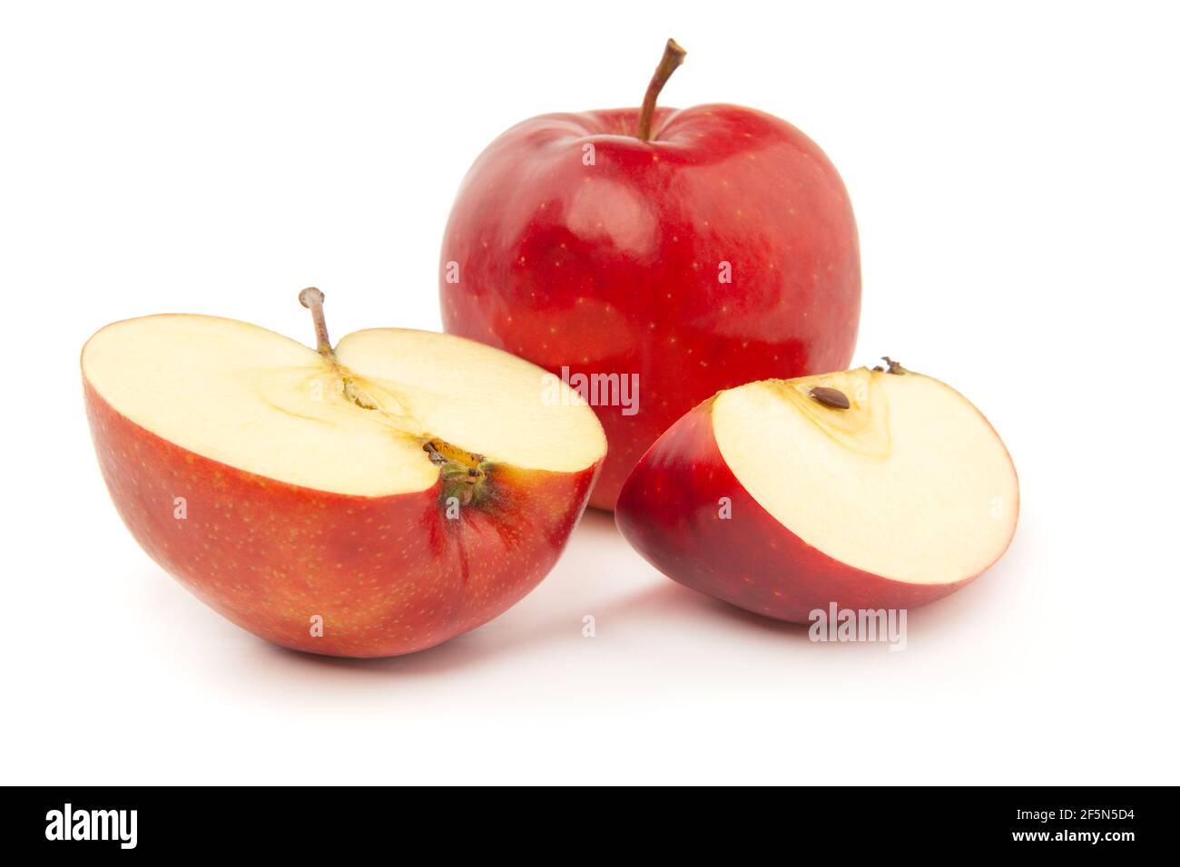 A whole and sliced red apple on a white background Stock Photo - Alamy