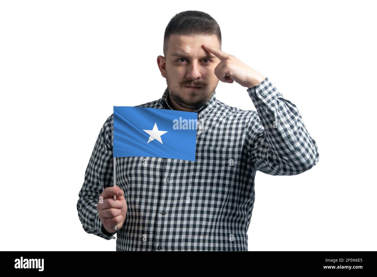 White guy holding a flag of Somalia and a finger touches the temple on ...