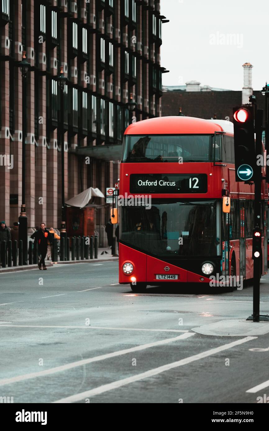 London UK February 2021 Vertical shot of a red double decker bus number ...