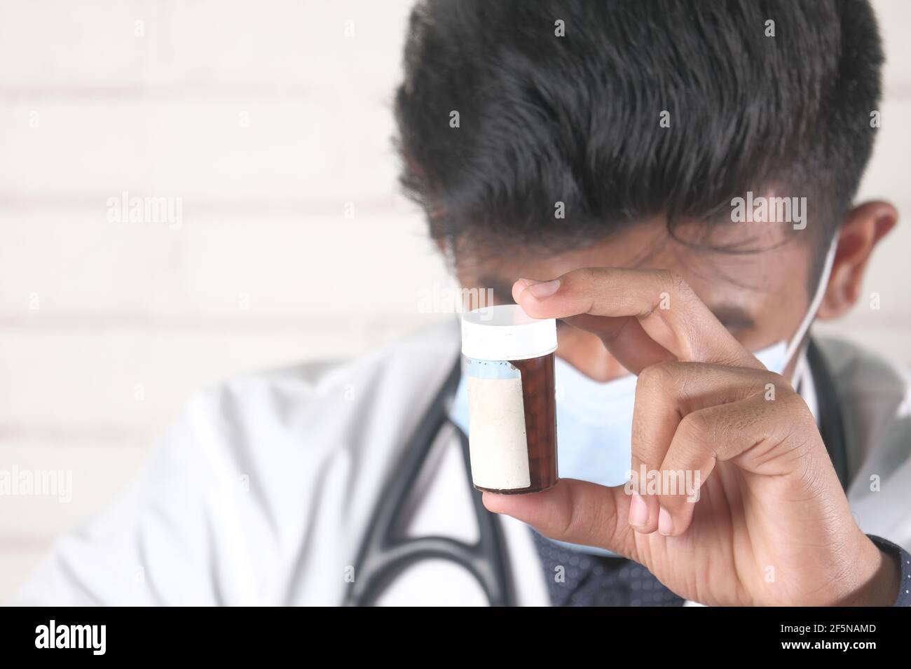 Doctor hand holding pill container hi-res stock photography and images ...