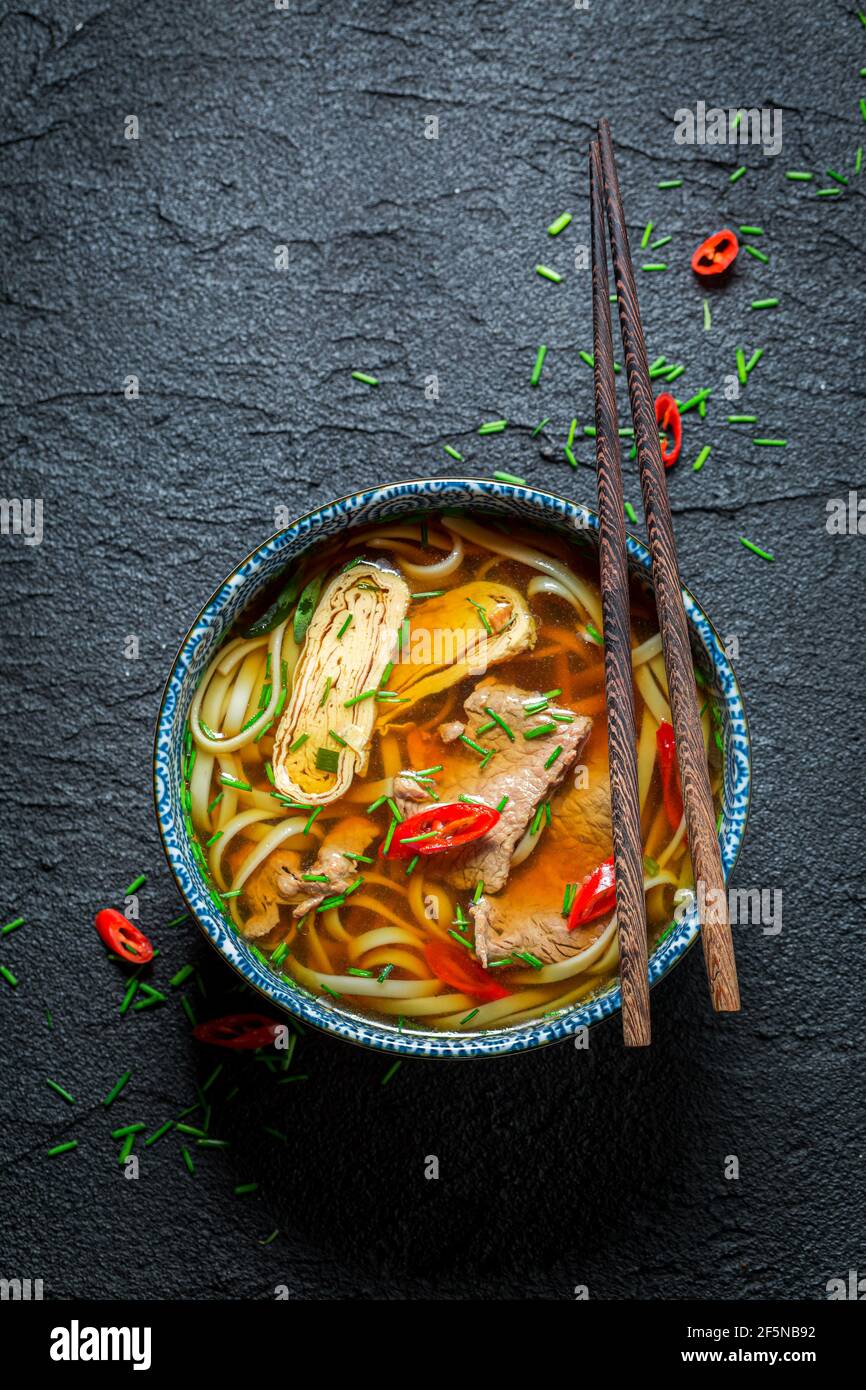Top down view of Red Curry soup with chopsticks. Traditional Thai ...