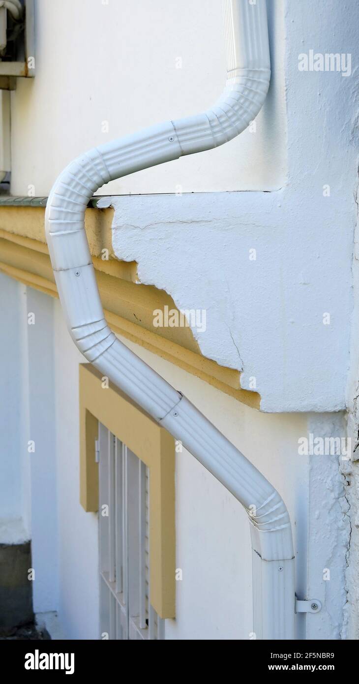 Front wall ledge circumvented by bending plastic drainpipe Stock Photo ...