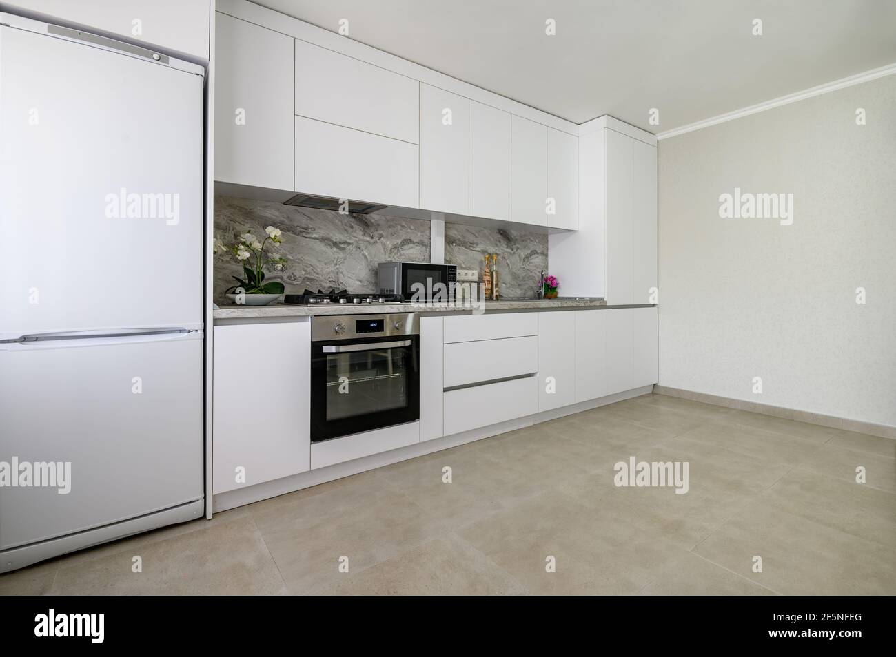 White large modern kitchen interior Stock Photo - Alamy