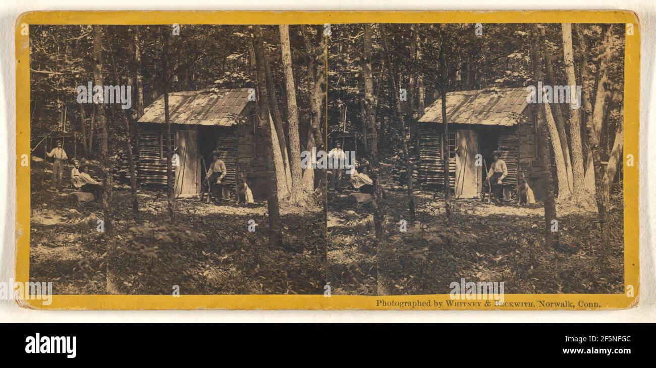 Family posed in front of their log cabin in the woods. Whitney ...