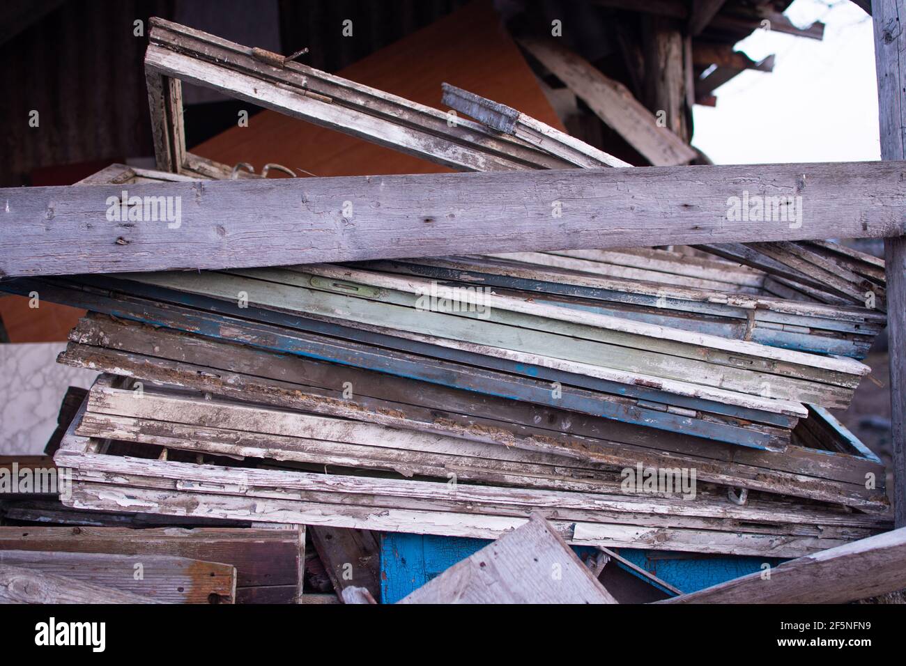 Warehouse of old wooden window frames. Reuse of wood waste Stock Photo ...