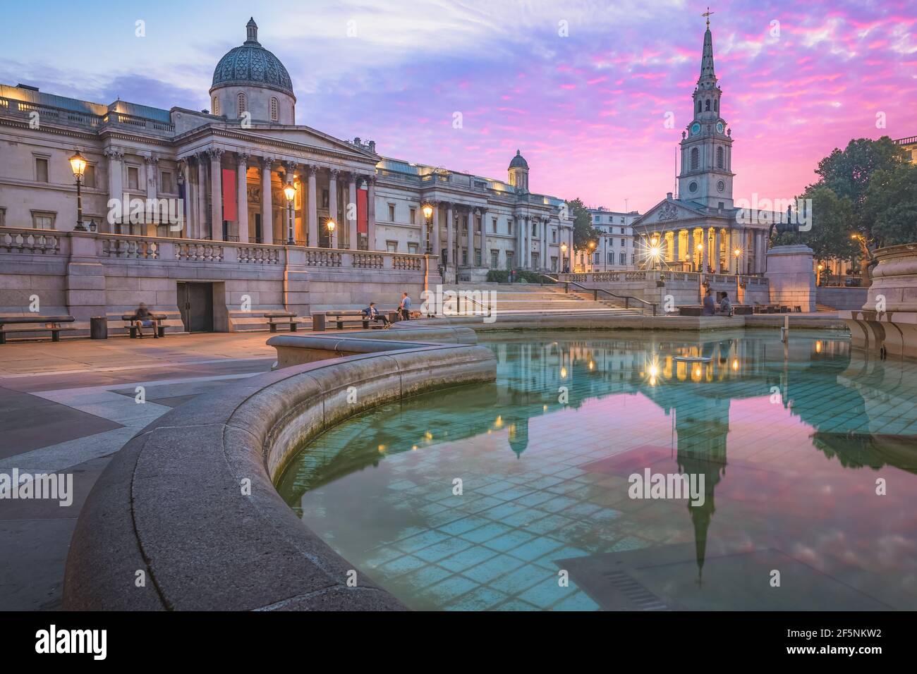 A vibrant colourful, dramatic sunrise or sunset sky at Trafalgar Square ...