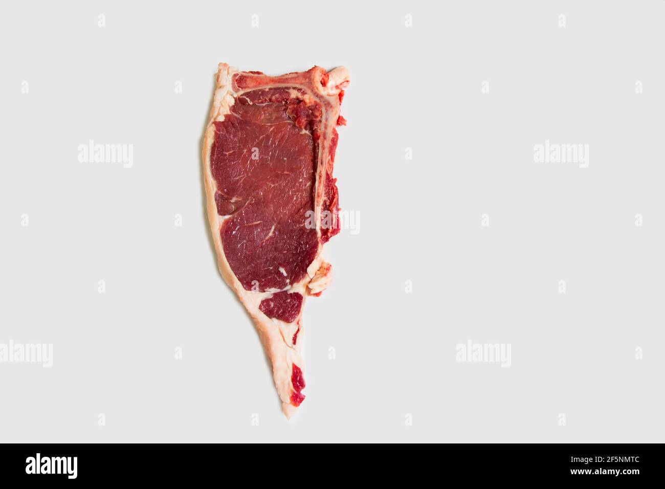 Fresh raw beef steak. Close-up raw rib eye steak isolated on white ...