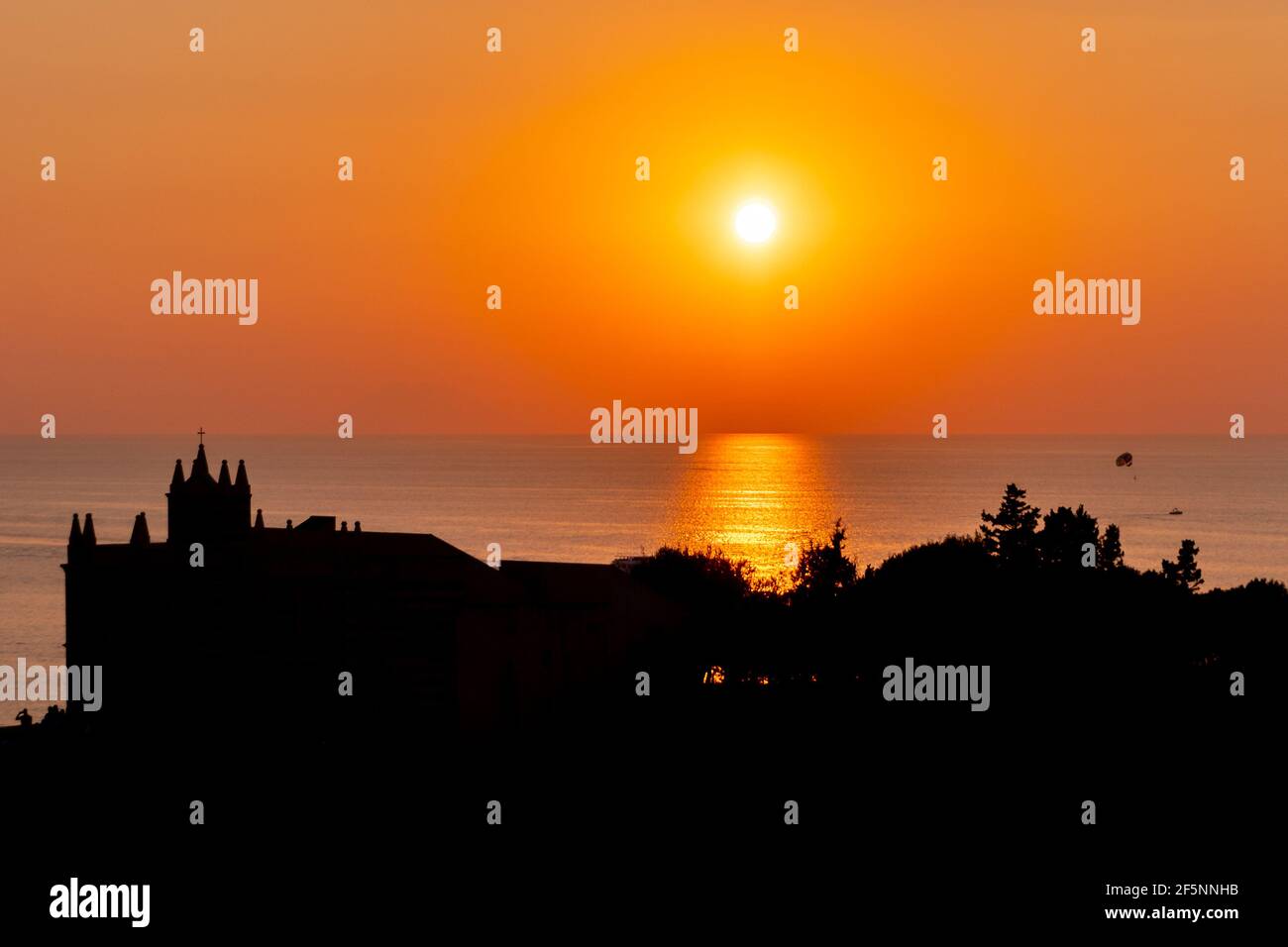 Skyline of The Sanctuary of Santa Maria dell'Isola of Tropea at sunset ...