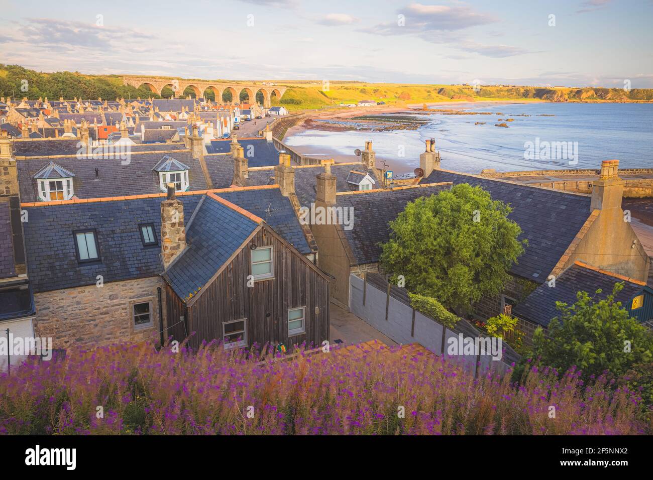 Scenic colourful townscape view of the quaint seaside fishing village ...
