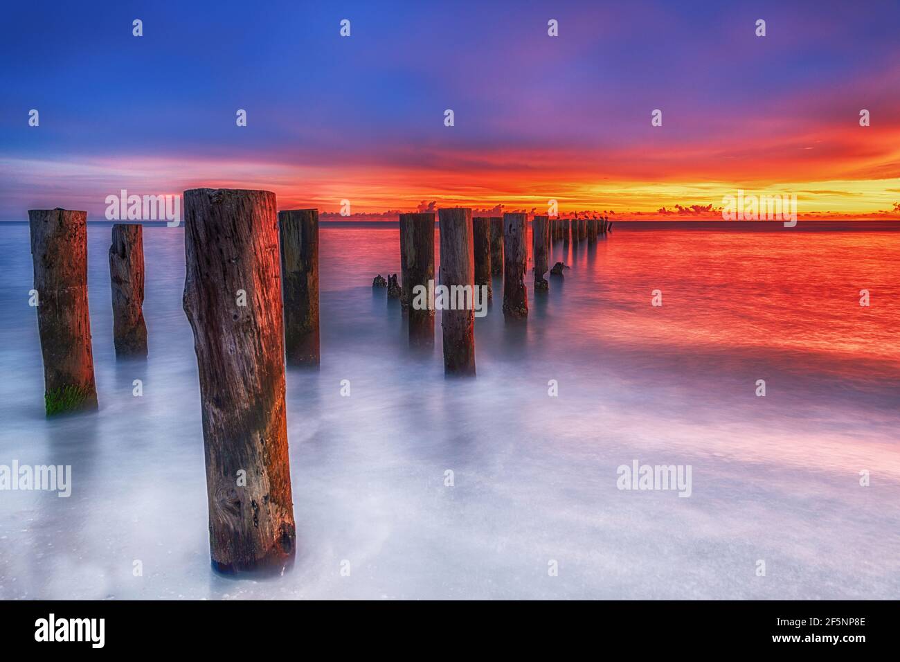 Gorgeous scenic shot of the famous old Naples Pier in Florida, during a ...