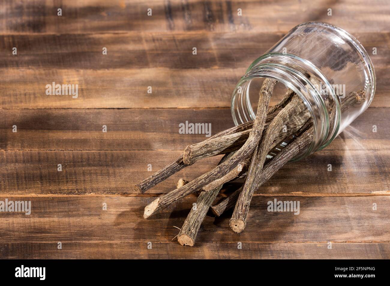 Dried stems of medicinal valerian on wooden background - Valeriana ...