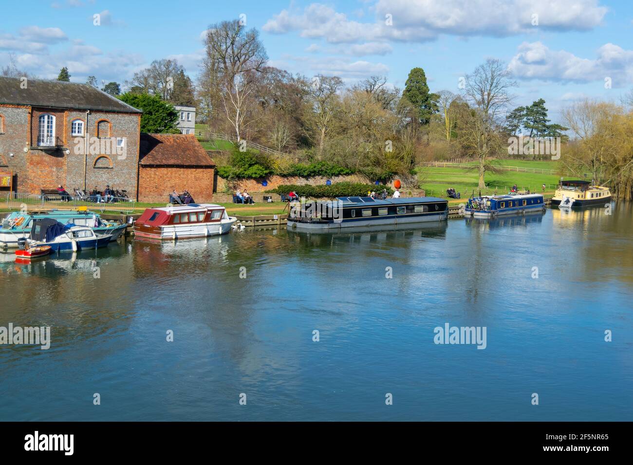 View of the river Thames with some boats and Riverside Park and Pools ...