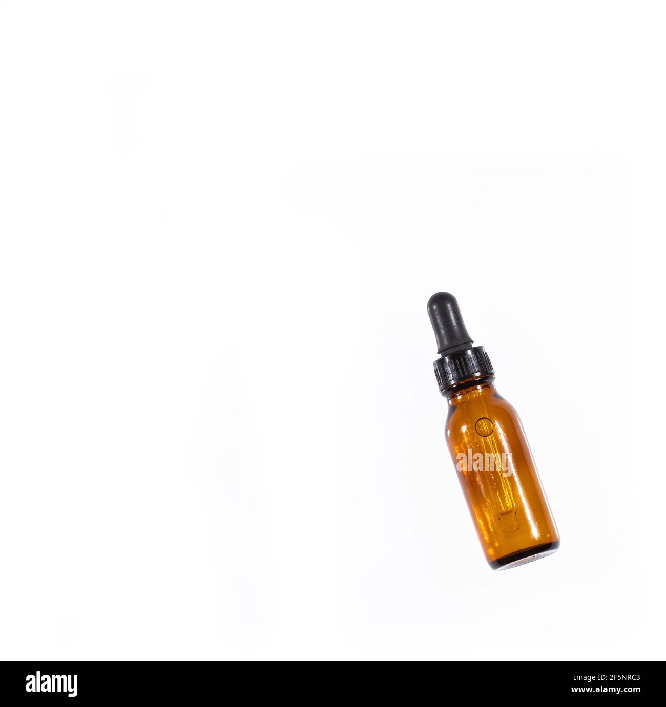 Brown dropper bottle isolated on white background Stock Photo - Alamy