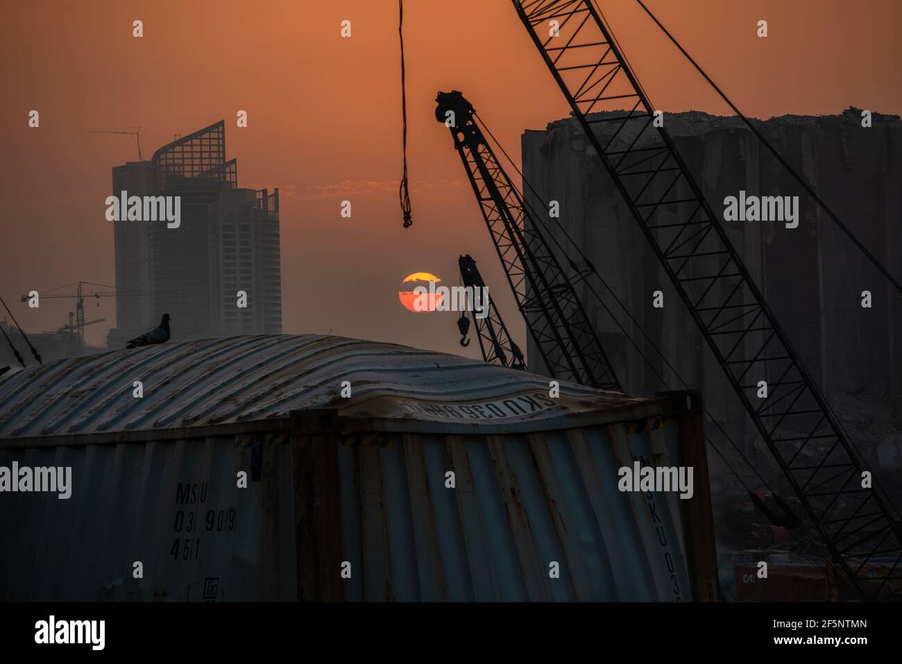 Beirtu Port Sunset after 4th of August explosion Stock Photo - Alamy