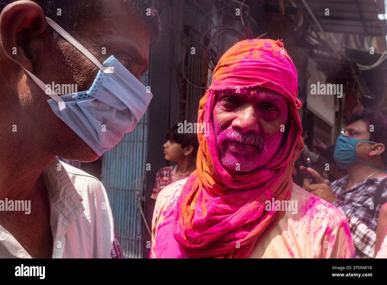 A man looks on during the festival.Holi is a popular ancient Hindu ...