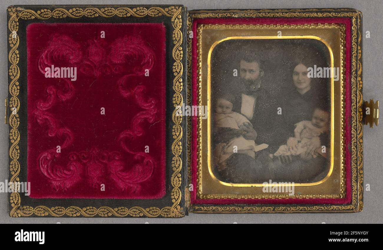 Family Portrait of a Mother and Father with Their Two Babies. Unknown ...