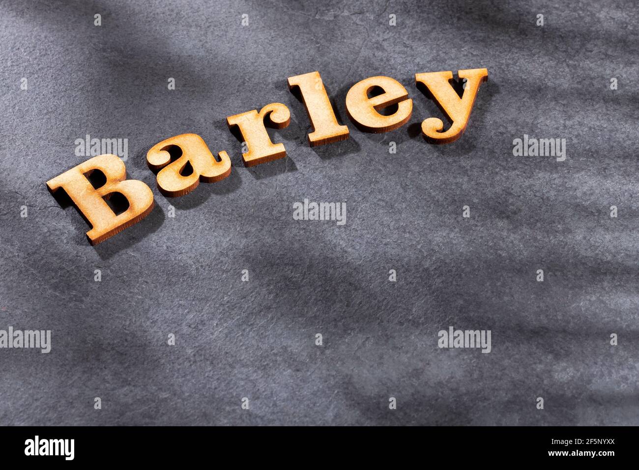 Barley word in wooden letters - Hordeum vulgare Stock Photo - Alamy