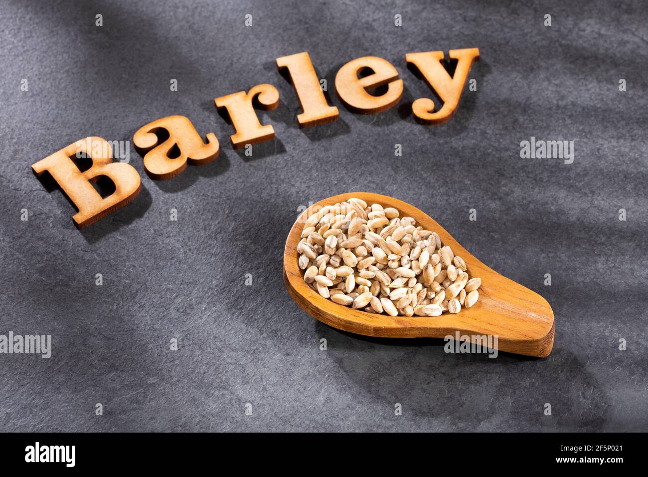 Barley word in wooden letters - Hordeum vulgare Stock Photo - Alamy