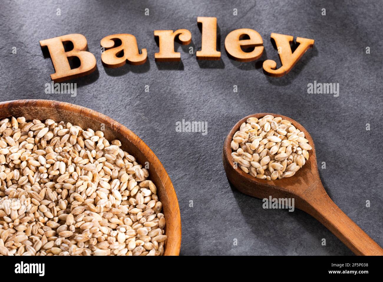 Barley word in wooden letters - Hordeum vulgare Stock Photo - Alamy