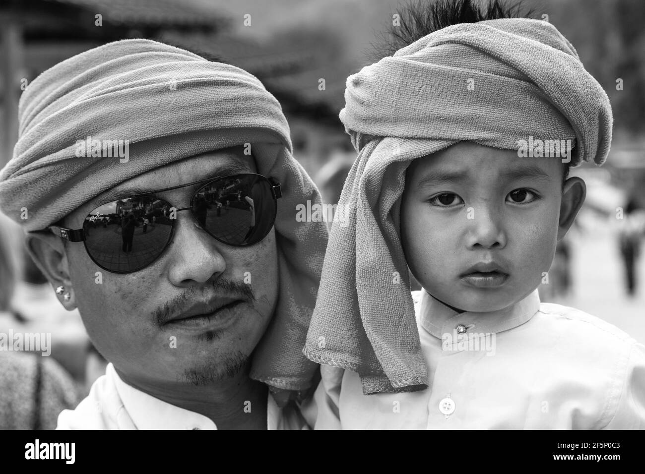 A Father and Son From The Danu Ethnic Minority In Traditional Costume ...