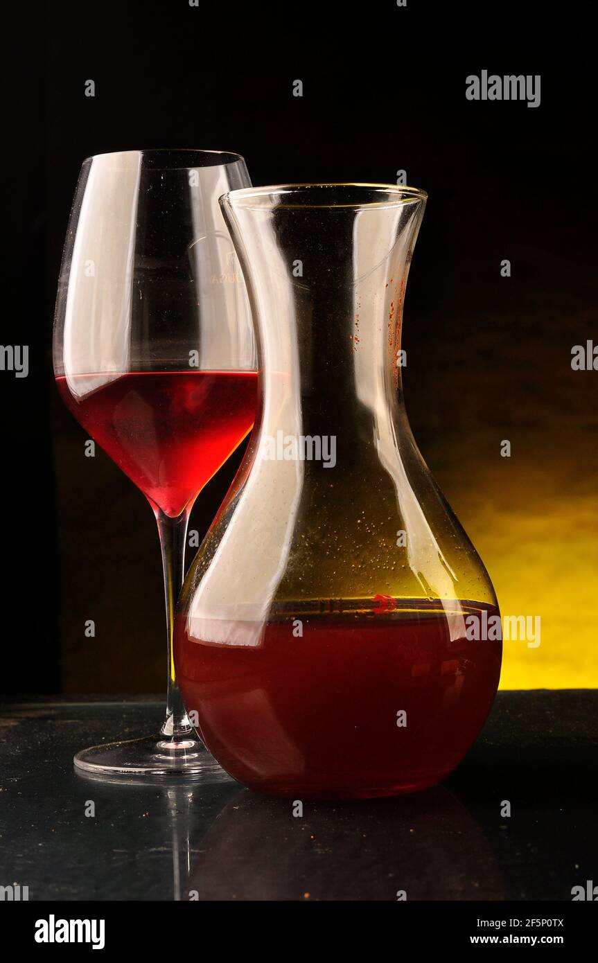 Glass and bottle of wine on a studio shot Stock Photo - Alamy