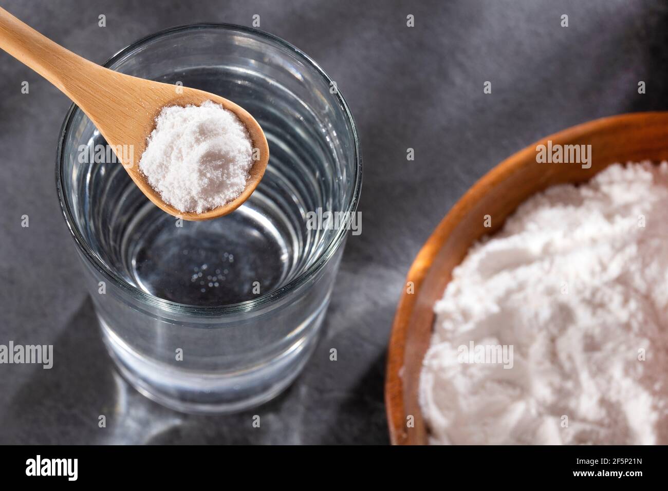 Spoon with baking soda to mix with water Stock Photo - Alamy