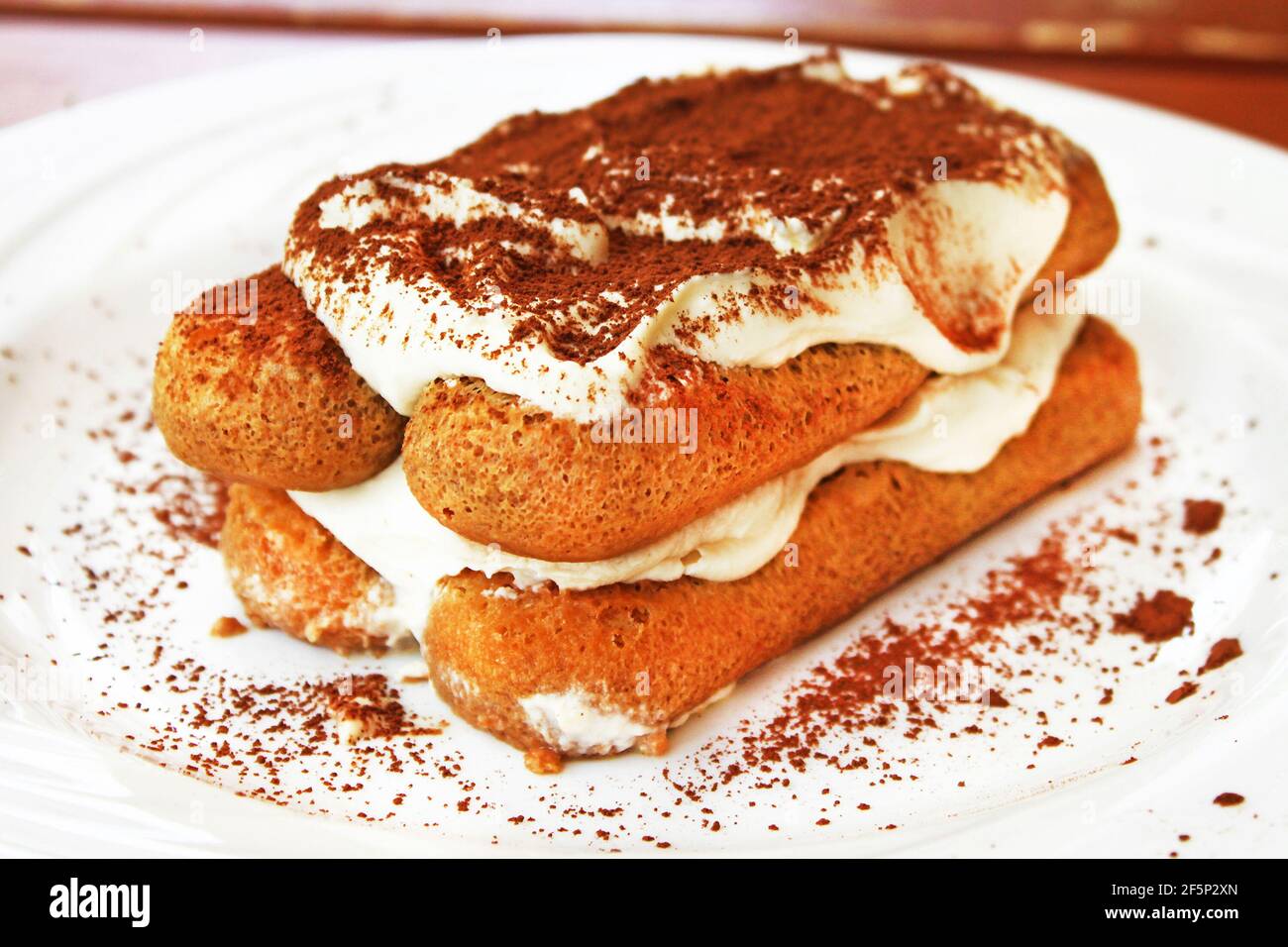 Tiramisu dessert on a plate Stock Photo - Alamy