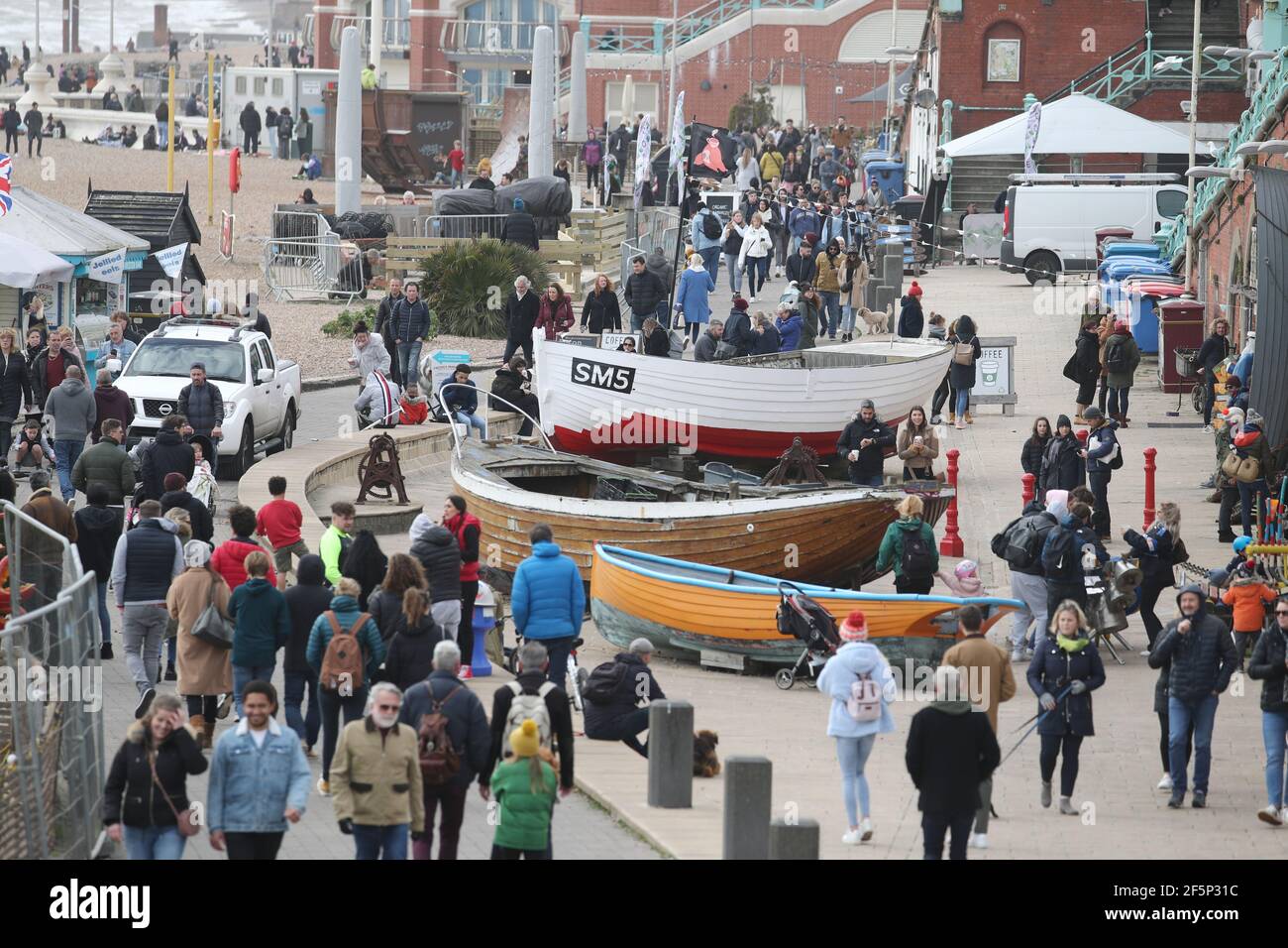 People on the promenade at Brighton ahead of the expected warm weather ...