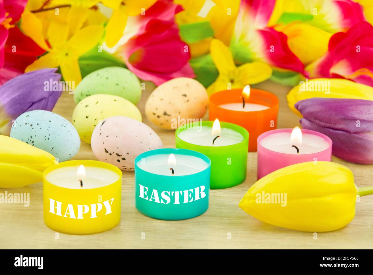 Happy Easter and colorful decoration with candles Stock Photo - Alamy