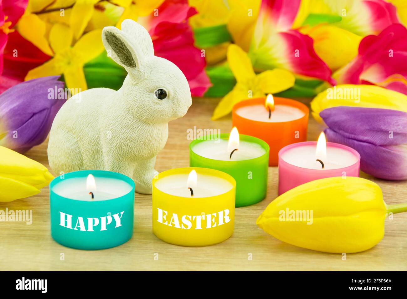 Happy Easter and colorful decoration with candles and bunny Stock Photo ...