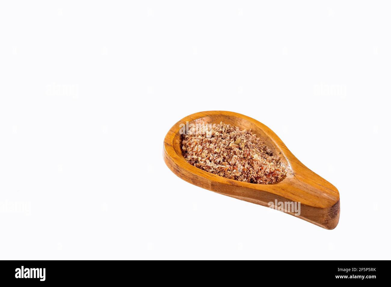 Crushed flax seeds in wooden spoon - Linum usitatissimum Stock Photo - Alamy