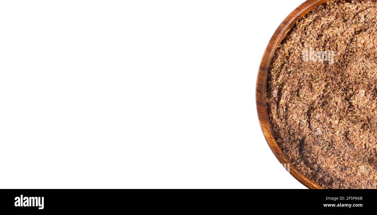 Crushed flax seeds in the wooden bowl - Linum usitatissimum Stock Photo ...