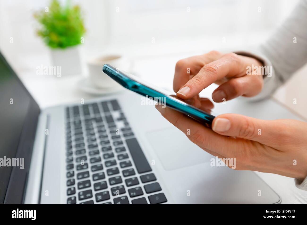 Using your phone and laptop for authentication Stock Photo - Alamy
