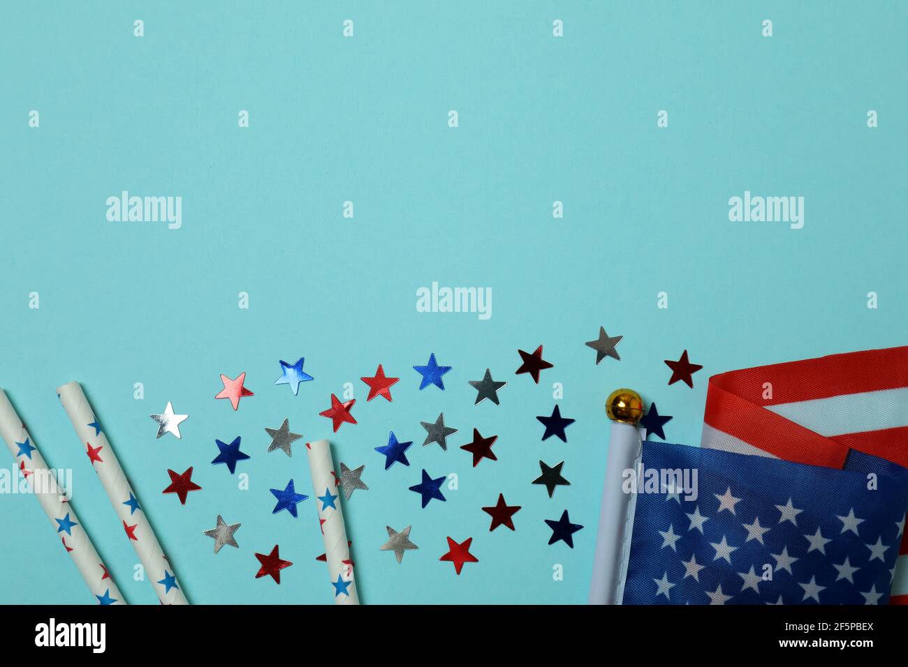 American flag, glitter and straws on blue background Stock Photo - Alamy