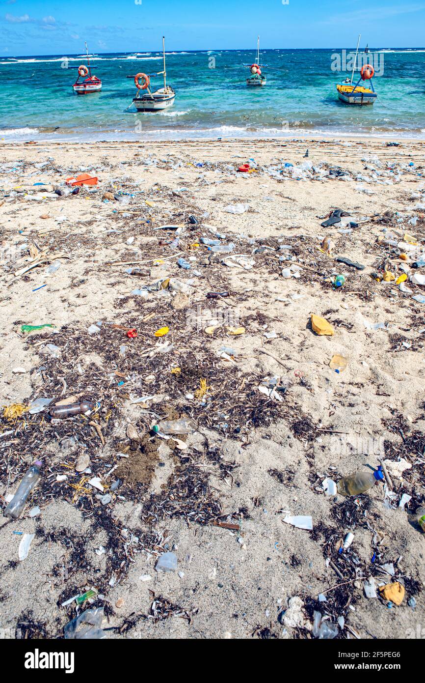heavy plastic pollution on the beach of tropical sea. Waste on beach ...