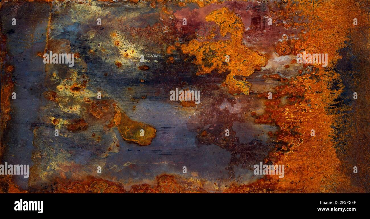 Rusty metal. Coroded and warped ash pan from solid fuel cooker left out ...