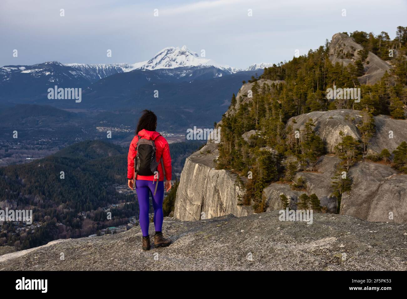 Adventurous Girl Hiking on top of a Peak Stock Photo - Alamy