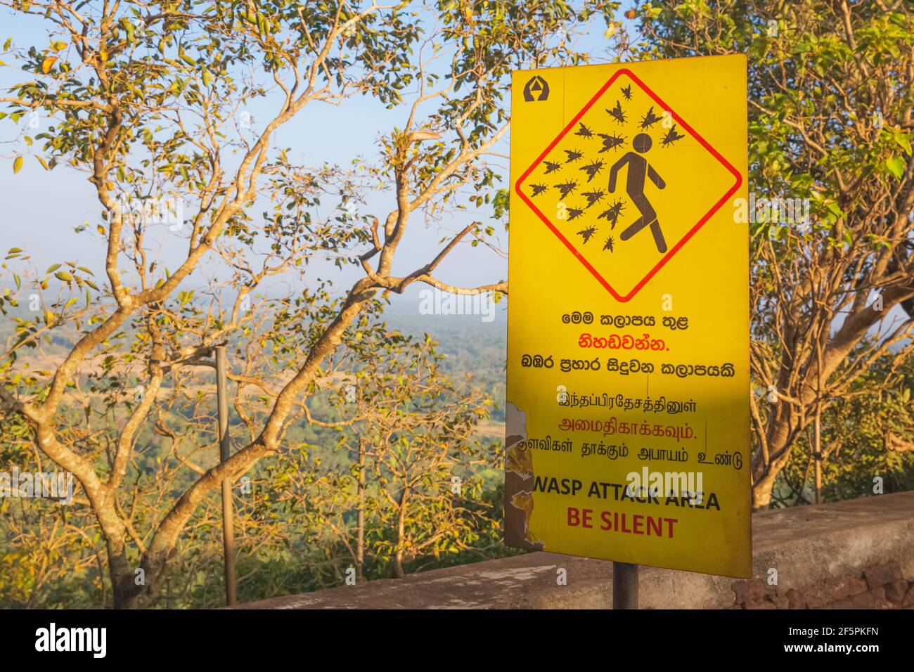 A warning sign of danger alerting tourist to be silent to avoid a wasp ...