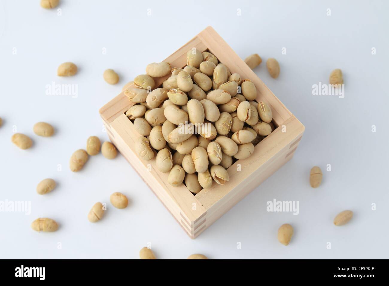 parched soy beans in measuring box isolated on white background Stock ...