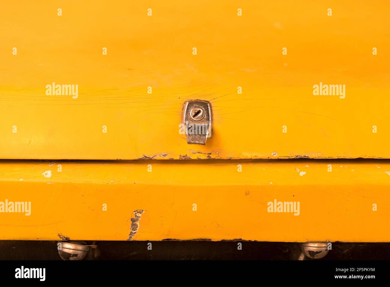 Trunk lock details of an antique yellow car in Turkey Stock Photo - Alamy