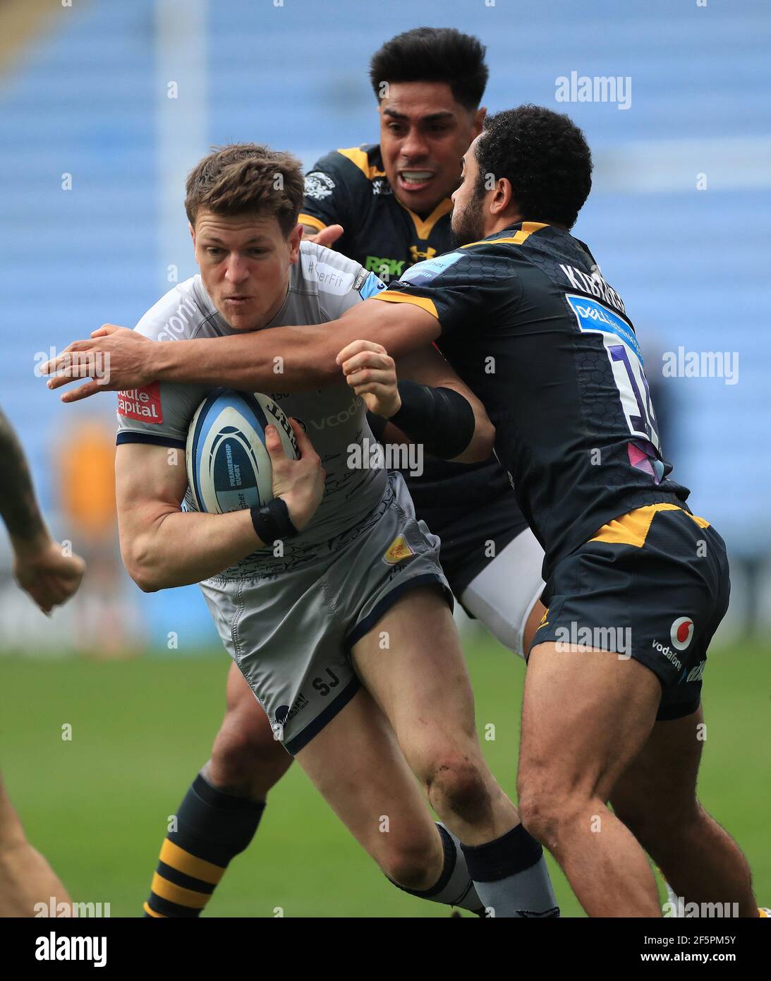 Sale Sharks' Sam James (left) is tackled by Wasps' Malakai Fekitoa ...