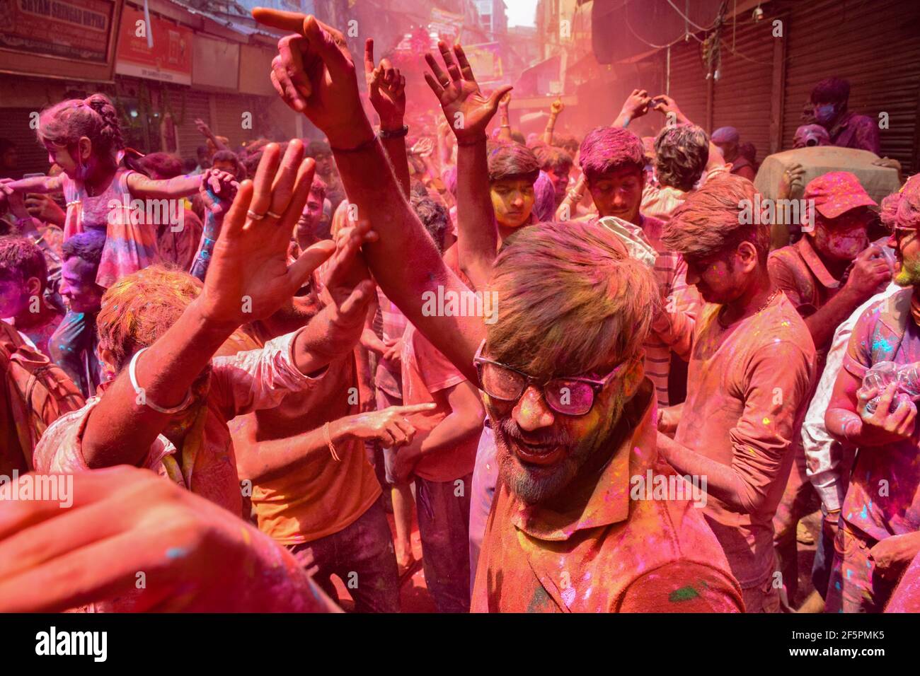 People are seen dancing during the Holi festival.Holi is a popular ...