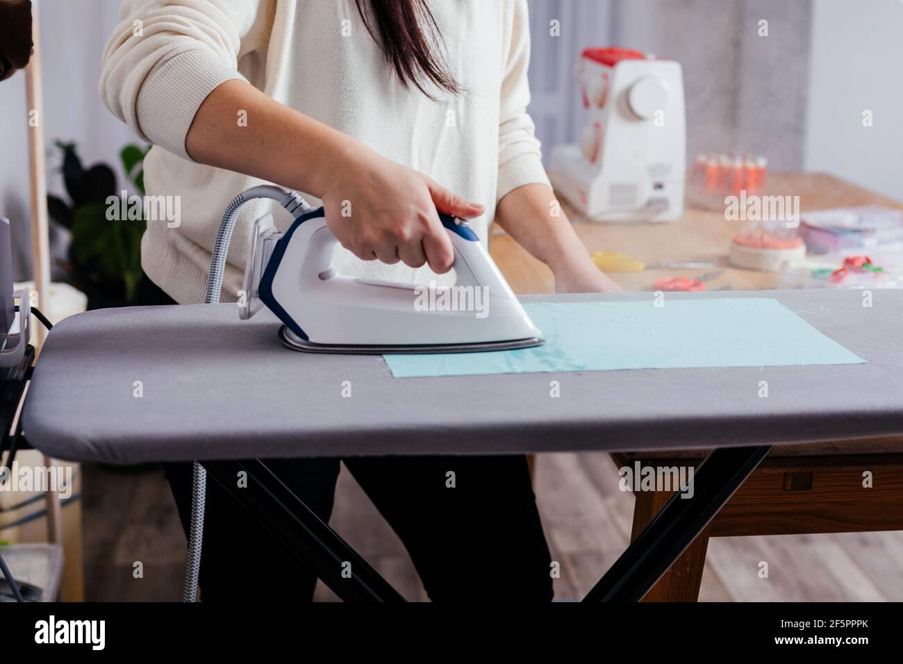 Process of ironing textile before cutting the pattern and sewing Stock ...