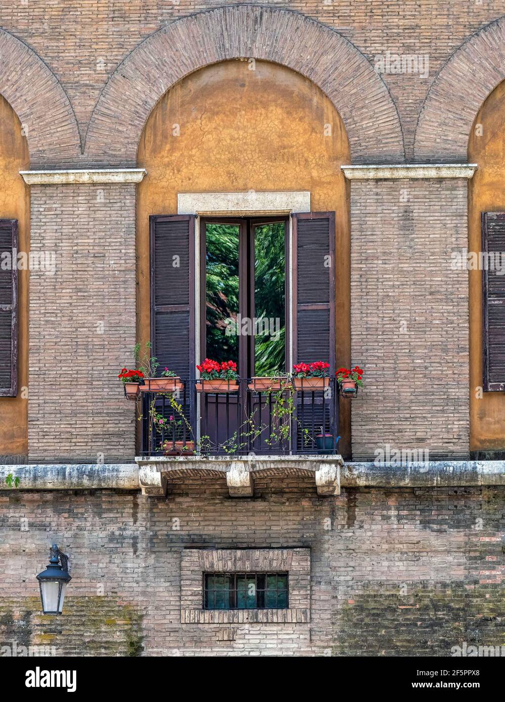 A beautiful balcony with potted flowers of the "FateBeneFratelli ...