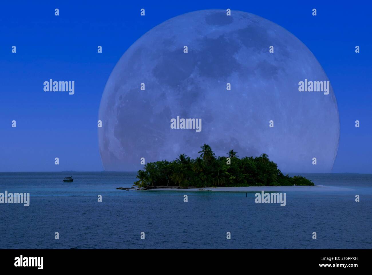 A full moon over the Maldives in the tropical waters of the Indian ...