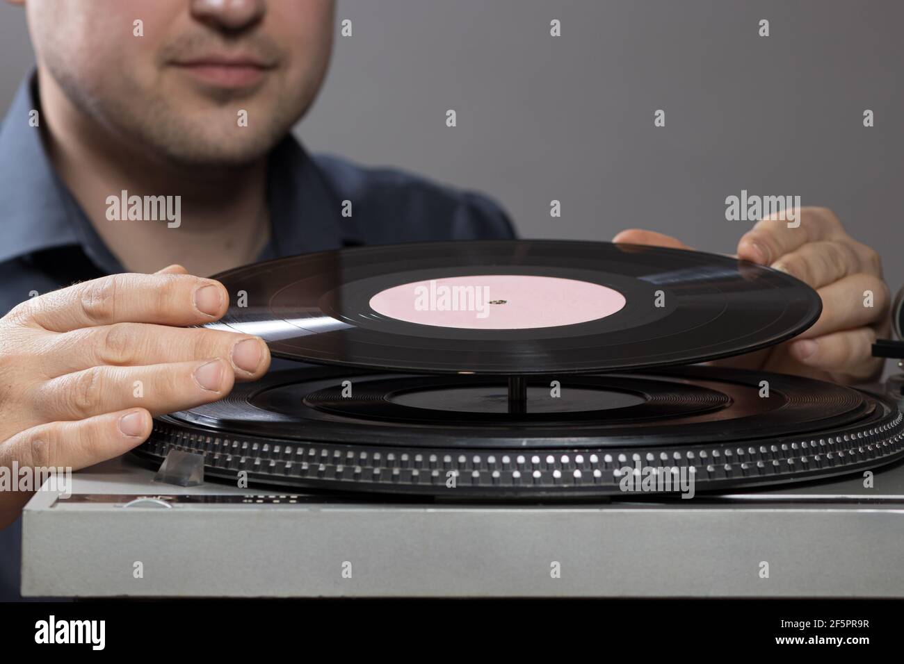 Man playing record player hi-res stock photography and images - Alamy