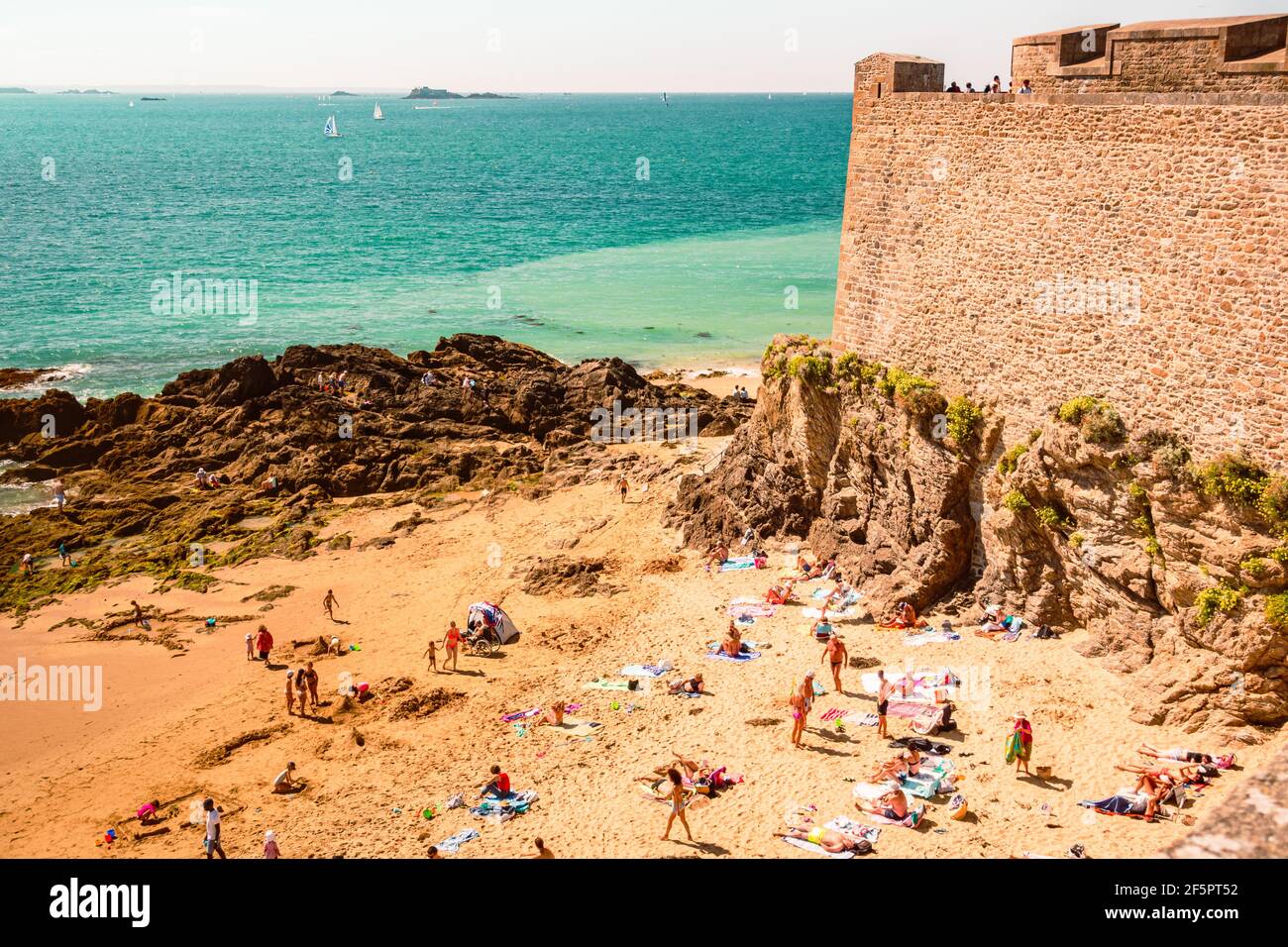 The beach and people sunbathing under city walls, from medieval ...