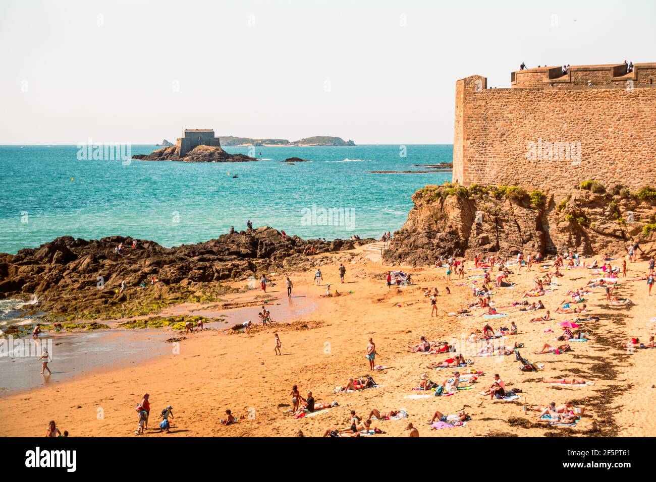 The beach and people sunbathing under city walls, from medieval ...